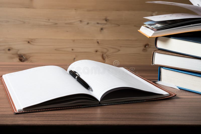 Open Book, Stack of Hardback Books on Wooden Table. Education Co Stock ...