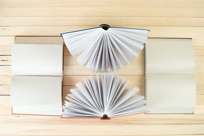 Open Book, Stack of Hardback Books on Wooden Table. Stock Image - Image ...