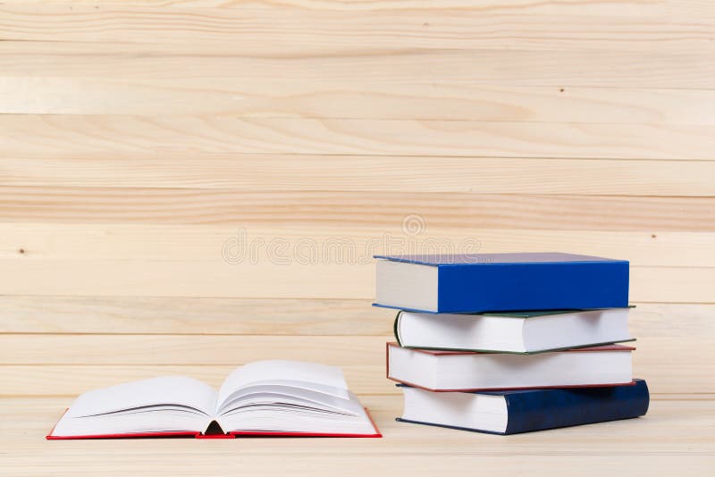Open Book, Stack of Hardback Books on Table. Top View. Stock Image ...
