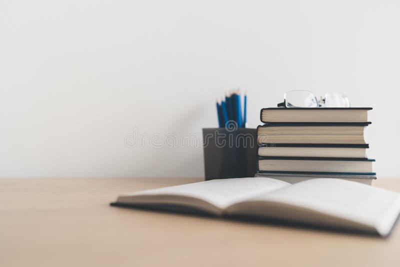 Open Book and Stack of Textbook on Table. Business Success Idea of ...