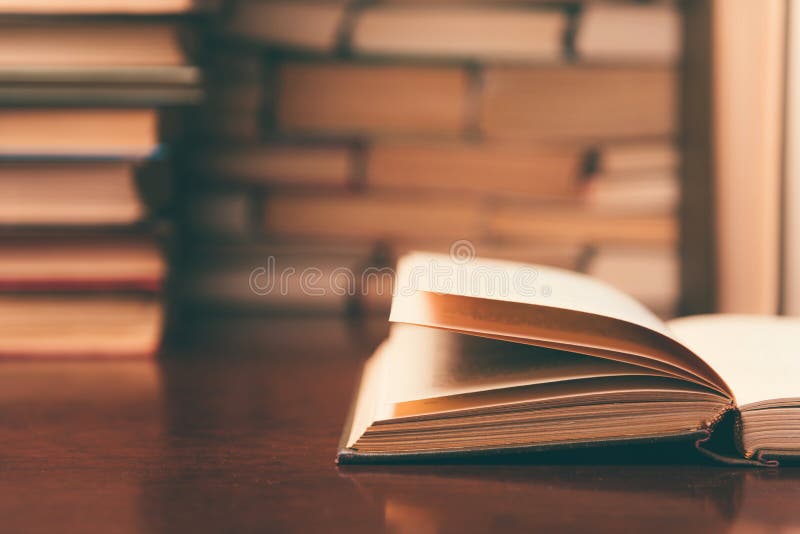 Book on the Table Against the Background of Books Stock Image - Image ...