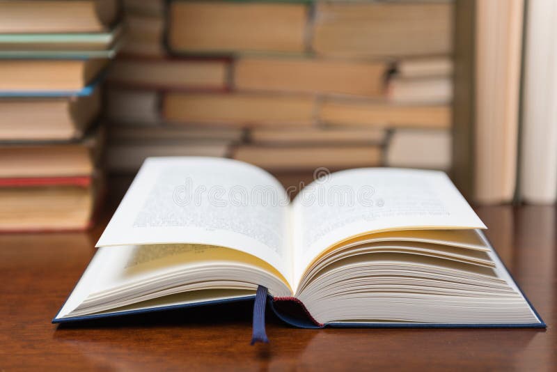 Book on the Table Against the Background of Books Stock Image - Image ...