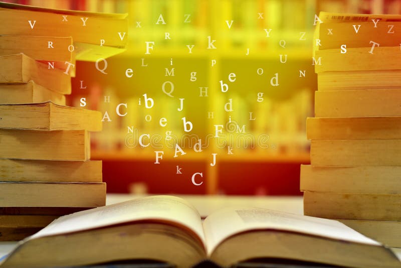 Open Book on the Table and English Alphabet Floating Above the Book ...