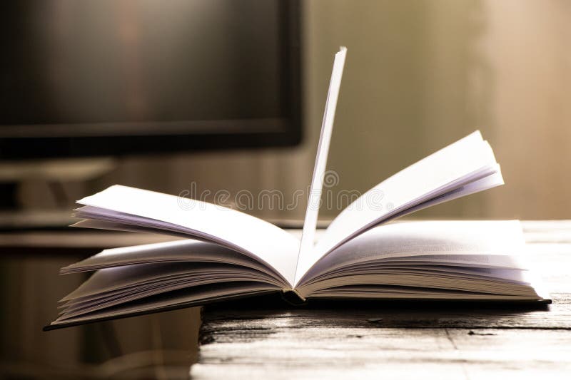 An Open Book on a Table at Home in the Light Stock Photo - Image of ...