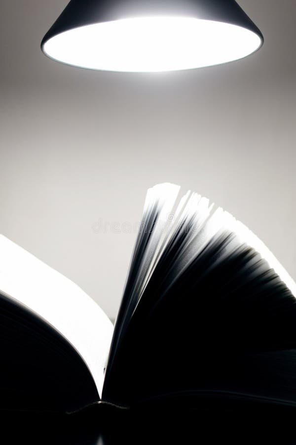 Open Book on Table Lamp in Dark Stock Photo - Image of dark, vertical ...