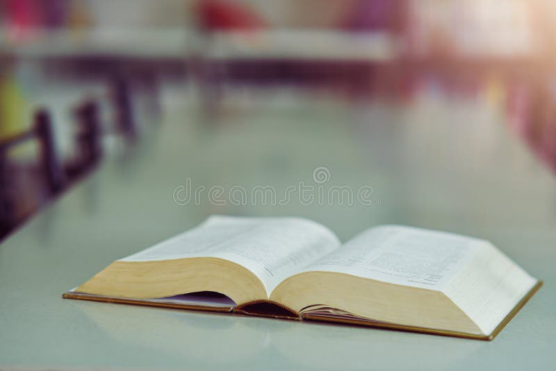 Open book on the table stock photo. Image of antique - 228798428