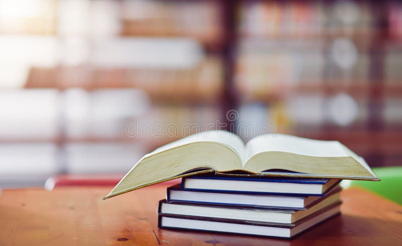 Open book on the table stock image. Image of brown, pile - 228798447