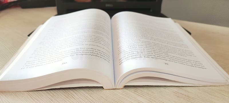 Open Book on a Table, with Notebook on the Side. a Reading is Capable ...
