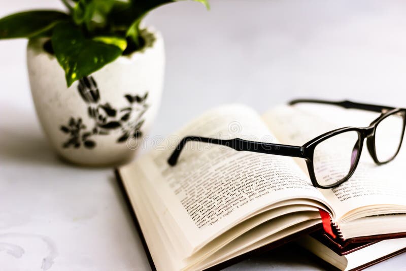 Open Book on the Table Top with Spectacles and Plant Stock Image ...