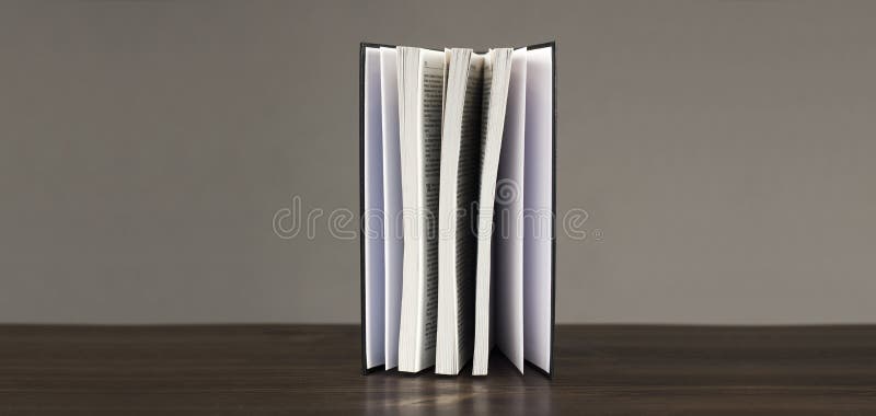 An Open Book is on the Table. Book Upright. Stock Photo - Image of desk ...