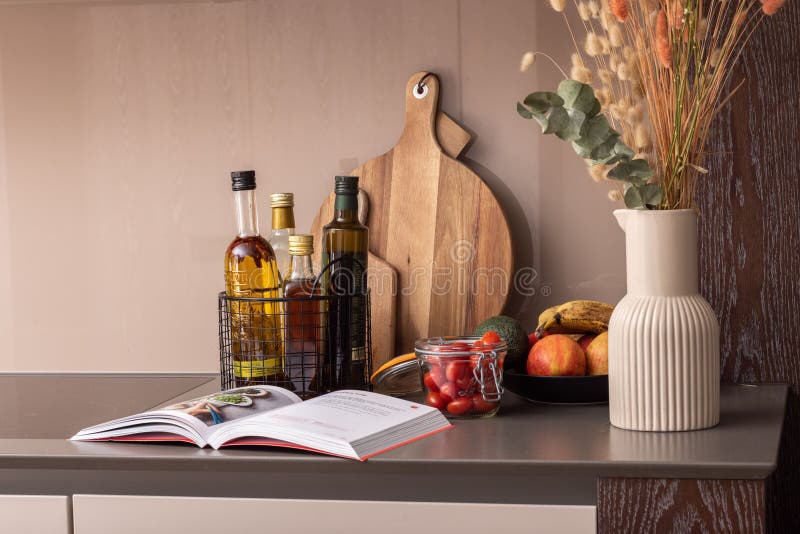 Open Book on Top of a Kitchen Counter with Various Cooking Ingredients ...