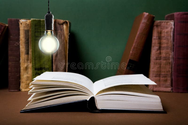 Open Book Under the Incandescent Bulb Stock Image - Image of design ...