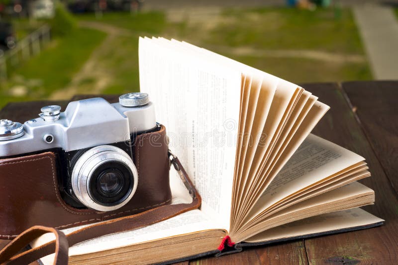 Open Book and Vintage Camera on Table. Copy Space. Stock Image - Image ...