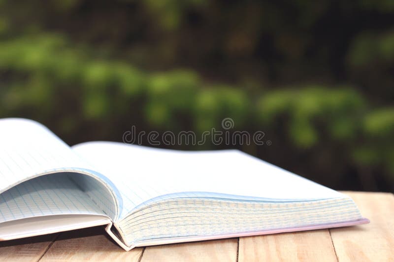 Open Book on Wood Table in the Garden Stock Image - Image of macro ...