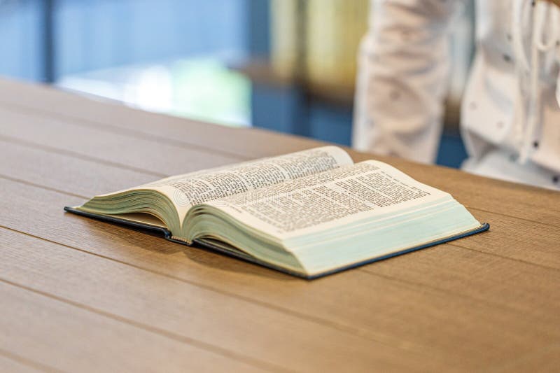Open Book on a Wooden Table Inside the Library Stock Photo - Image of ...