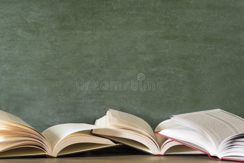 Open Books Against Green Chalkboard, Close Up Stock Photo - Image of ...