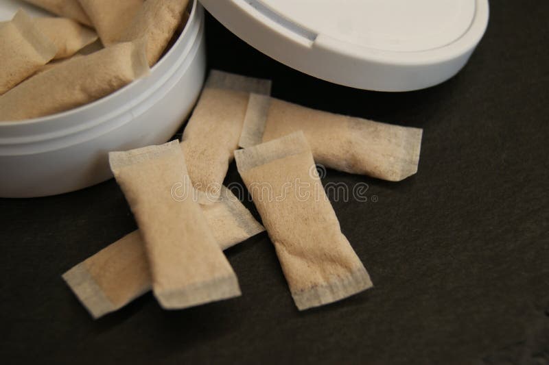 An Open Box of Nicotine Pouches. Packaging and Nicotine Pads on a Dark ...