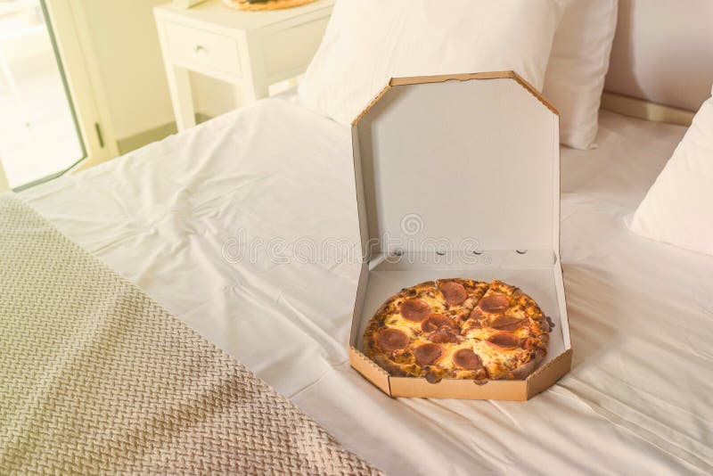 Open Box of Pizza on the Big Bed. Concept. Stock Photo - Image of ...