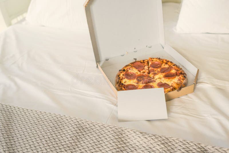 Open Box of Pizza on the Big Bed with Empty Card for Text. Concept ...
