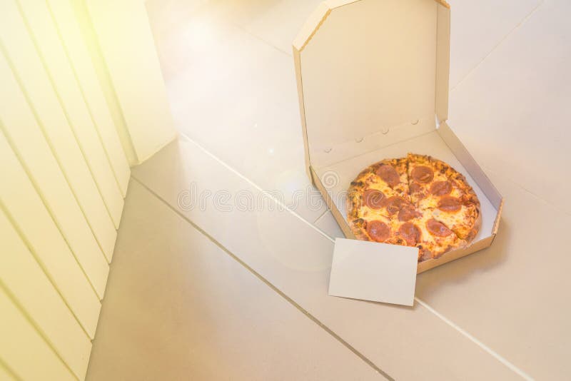 Open Box of Pizza with Empty Card for Text on Home Doorstep on Front ...
