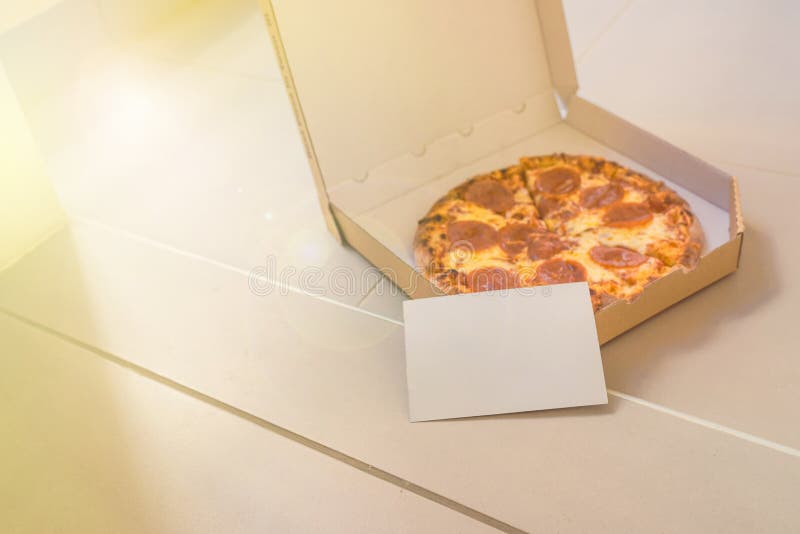 Open Box of Pizza with Empty Card for Text on Home Doorstep on Front ...