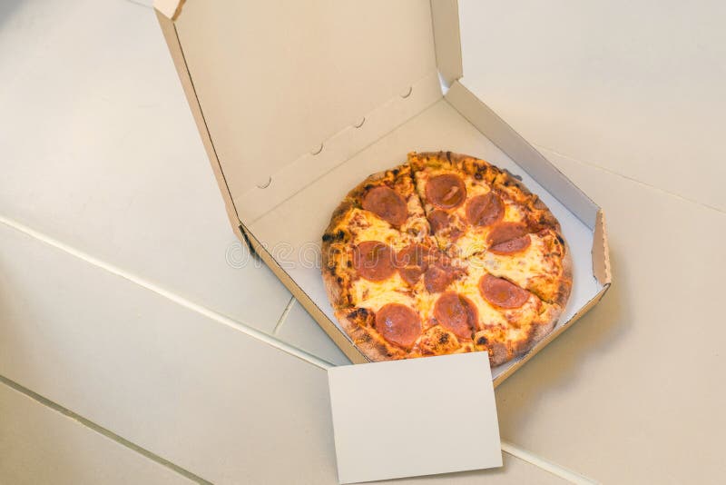 Open Box of Pizza with Empty Card for Text on Home Doorstep on Front ...