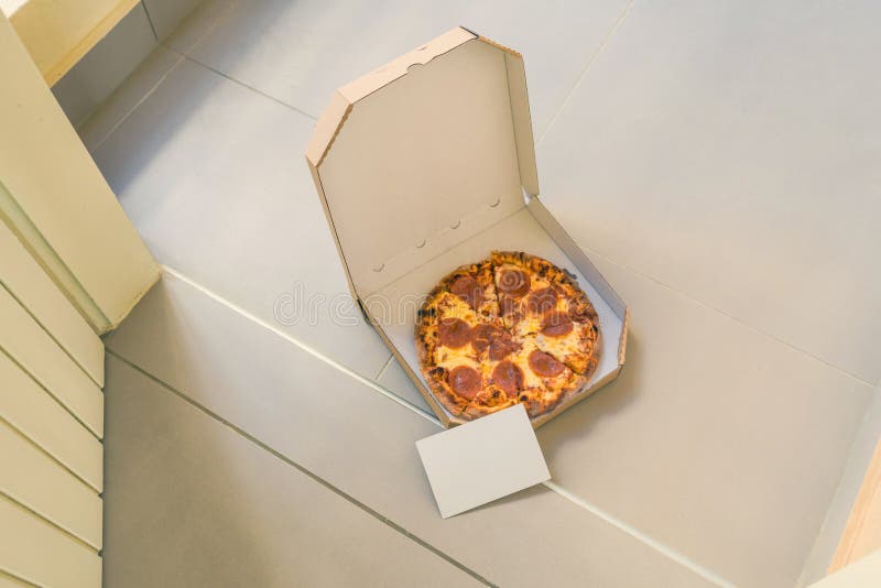 Open Box of Pizza with Empty Card for Text on Home Doorstep on Front ...
