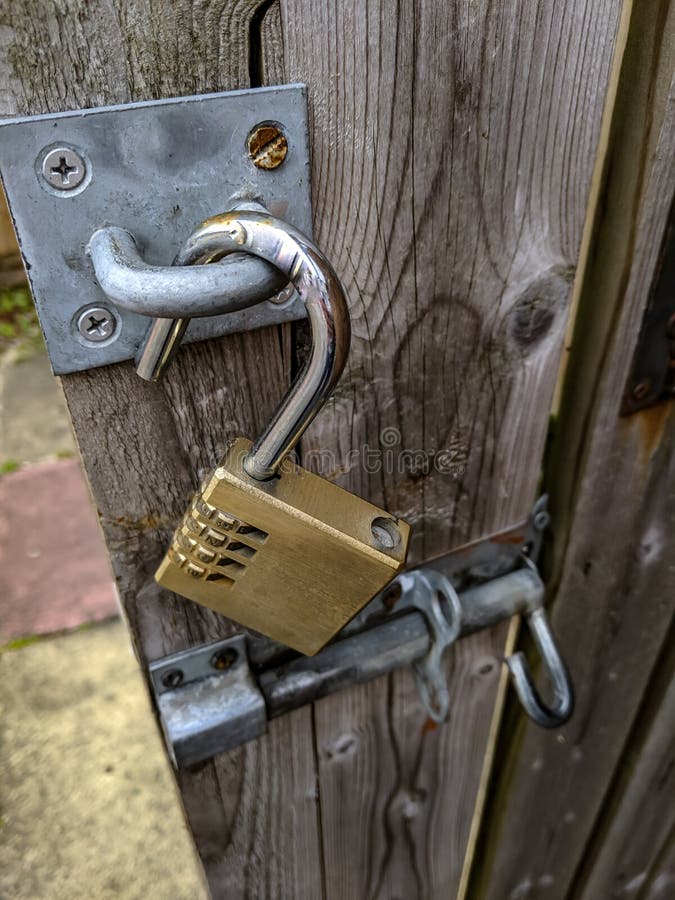 Brass Padlock Hook On Door Loop - Unlocked Stock Photo - Image of gate ...