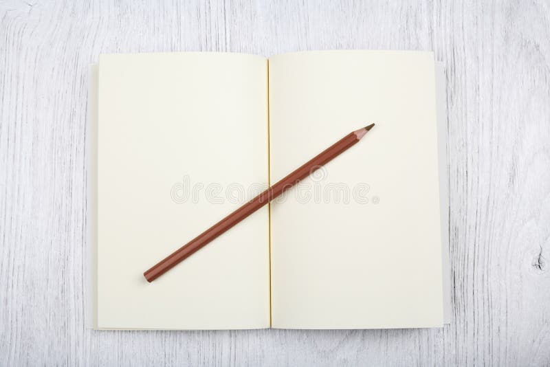 Open Brown Notebook And A Pencil On White Wooden Table, Top View Stock ...