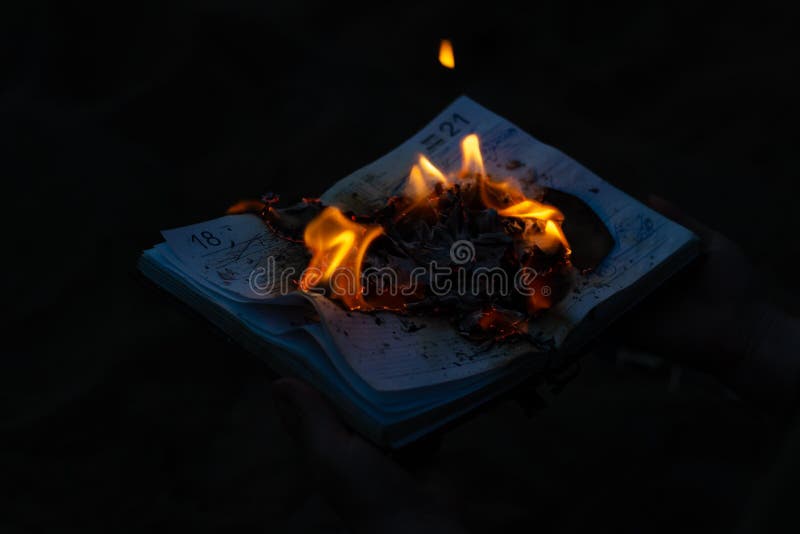 Open Burning Diary on Black Background. Notebook with Flame Cove Stock ...