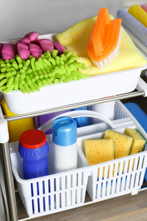 Open Cabinet with Different Cleaning Supplies in Kitchen Stock Photo ...
