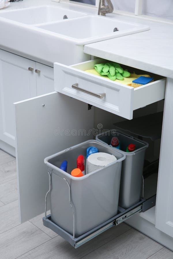 Open Cabinet and Drawer with Different Cleaning Supplies in Kitchen ...