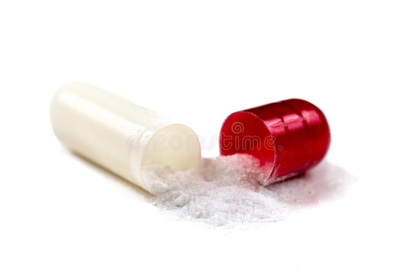 Open Capsule in Macro on a White-conceptual Background. Stock Photo ...