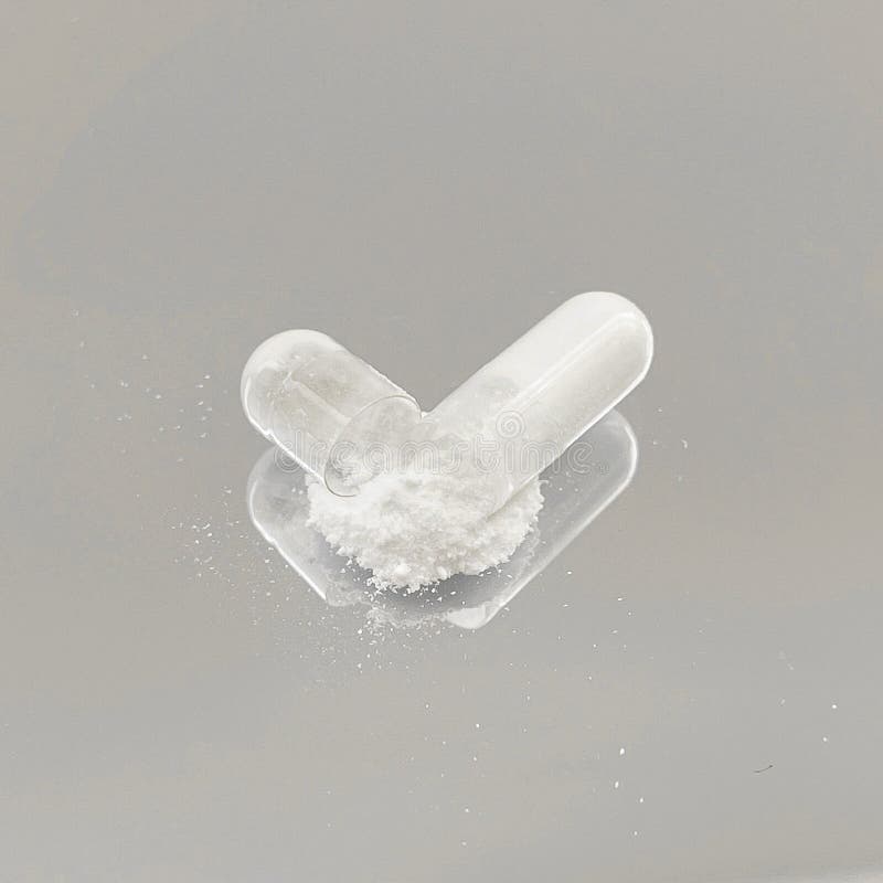 Open Capsule with White Powder on Reflective Surface Stock Image ...