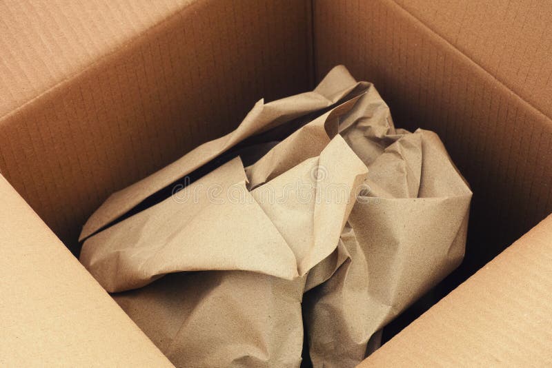 An Open Cardboard Box with Crumpled Paper Inside Stock Image - Image of ...