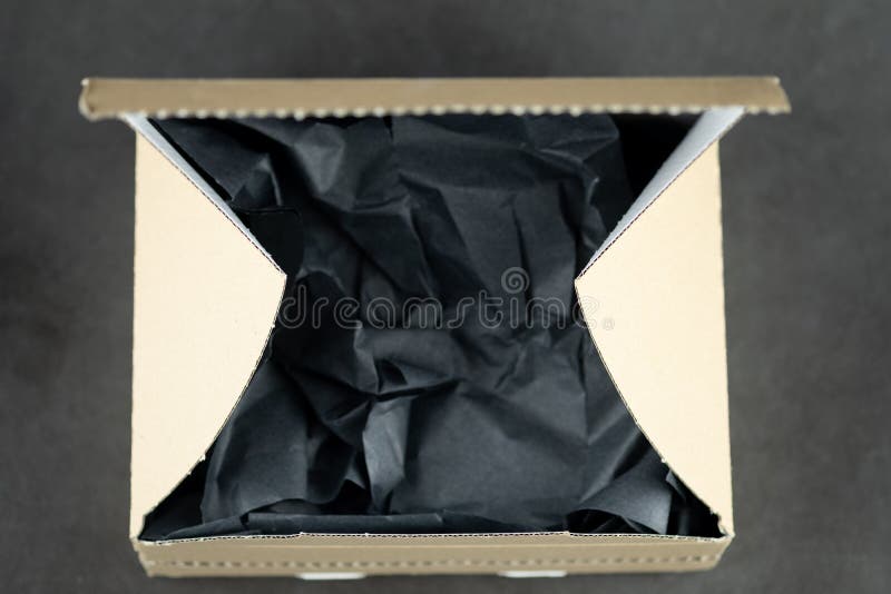Open Cardboard Box Filled with Black Shipping Paper Stock Image - Image ...