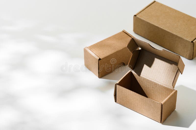 Open Cardboard Box on a Reflective Surface with Soft Shadows Stock ...