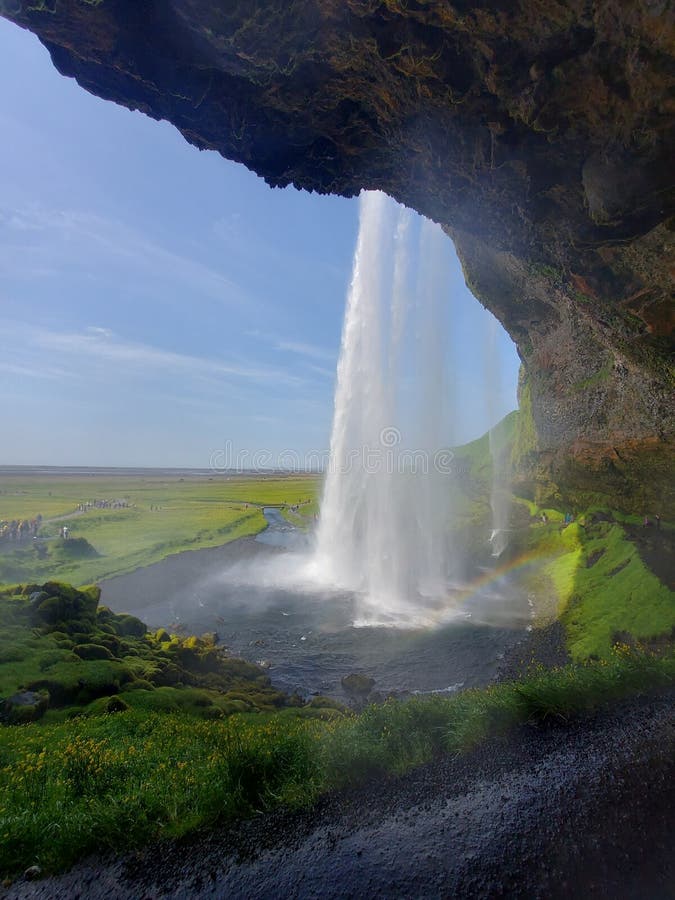 Open Cave with a Waterfall Spraying Out of the Side. Iceland Stock ...