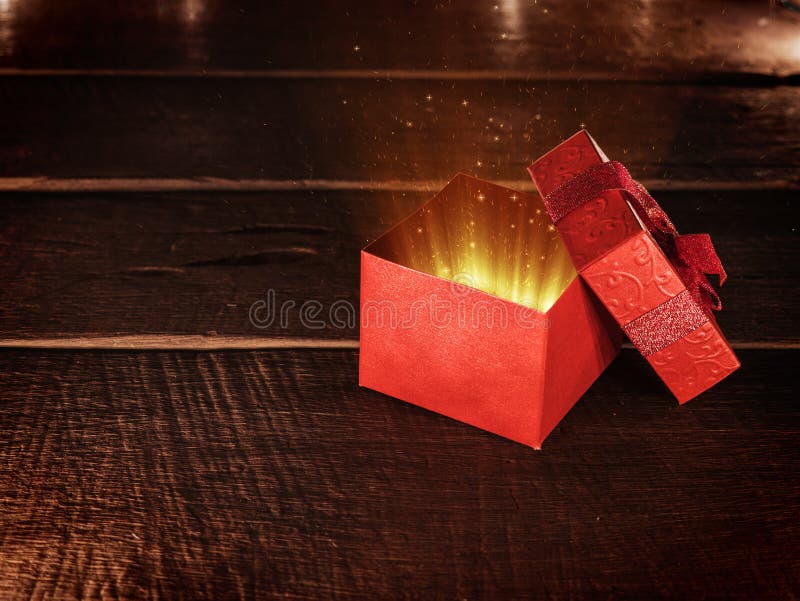 Open Christmas White Gift Box with Ray of Magic Light on Wood Desk ...
