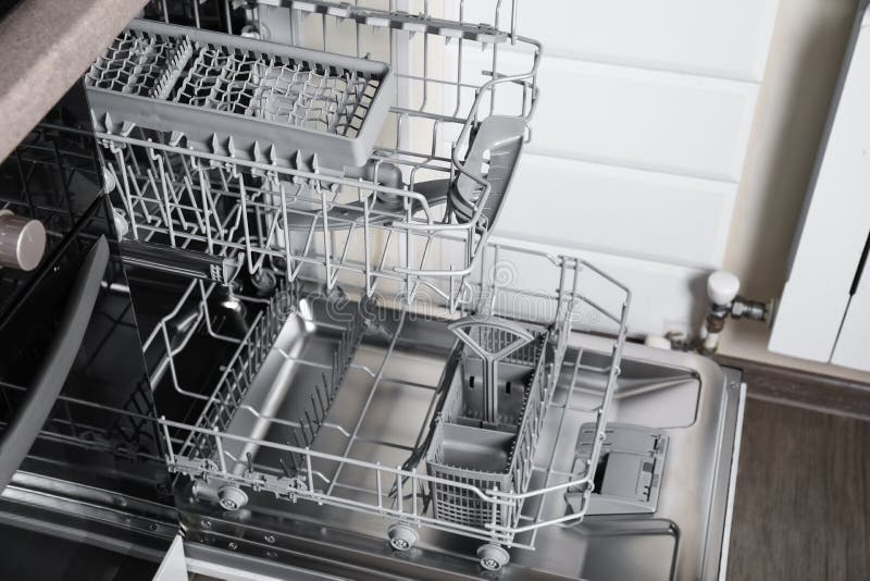 Open Clean Empty Dishwasher in Kitchen, Closeup Stock Photo - Image of ...