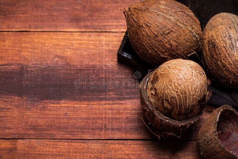 Open Coconut on a Wooden Table Top View Stock Photo - Image of milk ...
