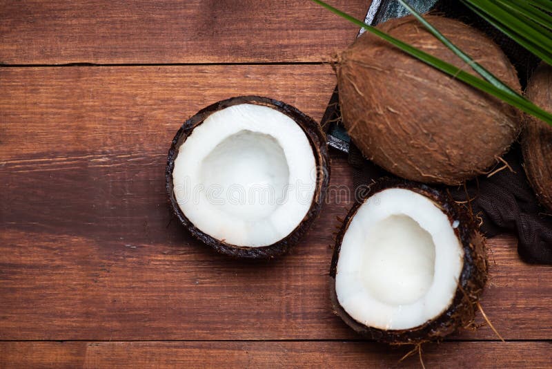 Open Coconut on a Wooden Table Top View Stock Photo - Image of ...
