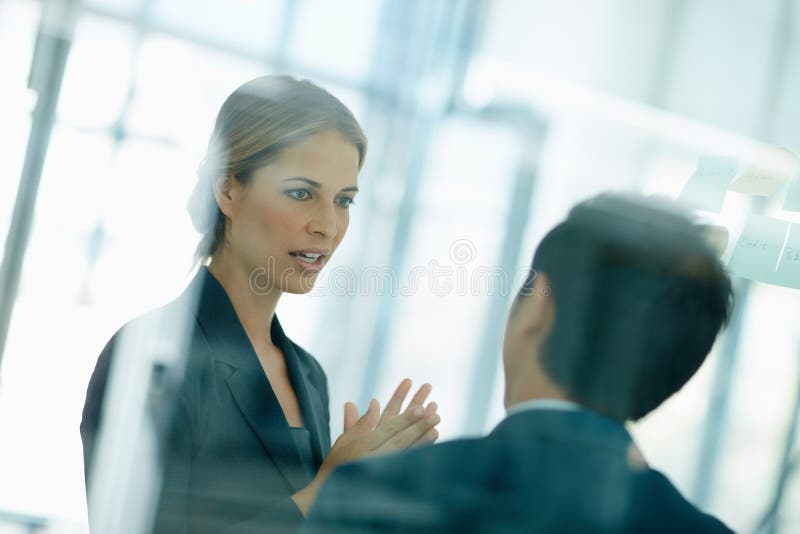 Open Communication is Paramount. Two Businesspeople Having a Discussion ...