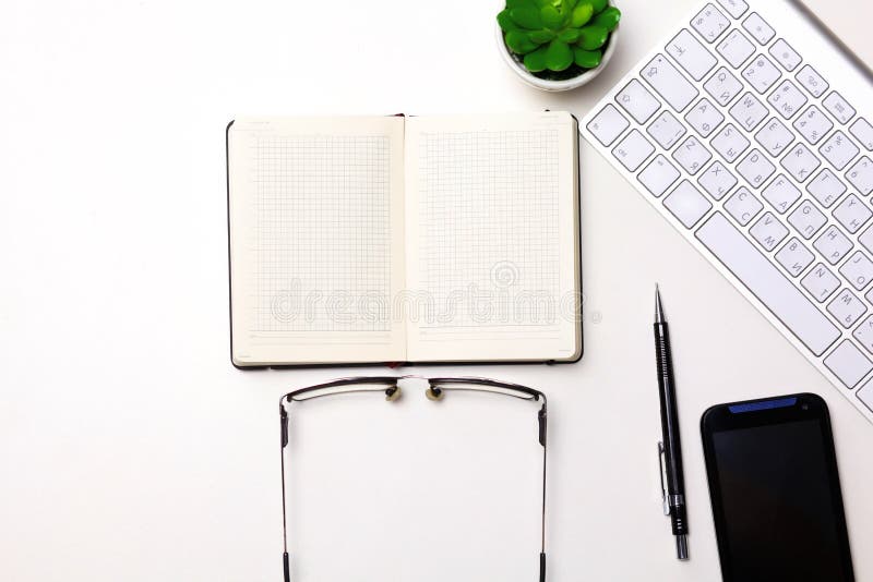 Open daily, a Computer and a Smartphone on the Desktop in the Office ...