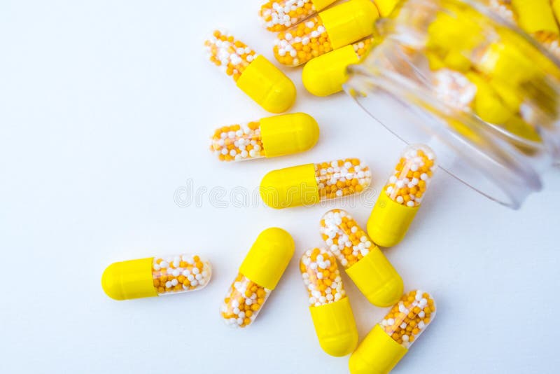 Open Container with Vitamin D3 Multivitamin Capsules on White ...