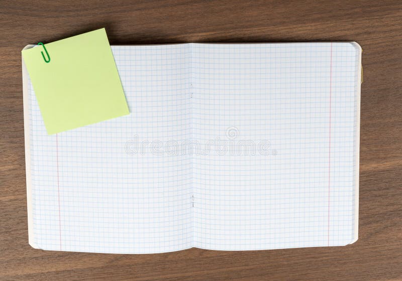Open copybook on table, Open copybook with sticker on wooden