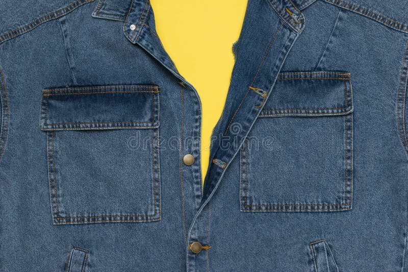 An Open Denim Jacket with a Yellow Background Inside Stock Photo ...