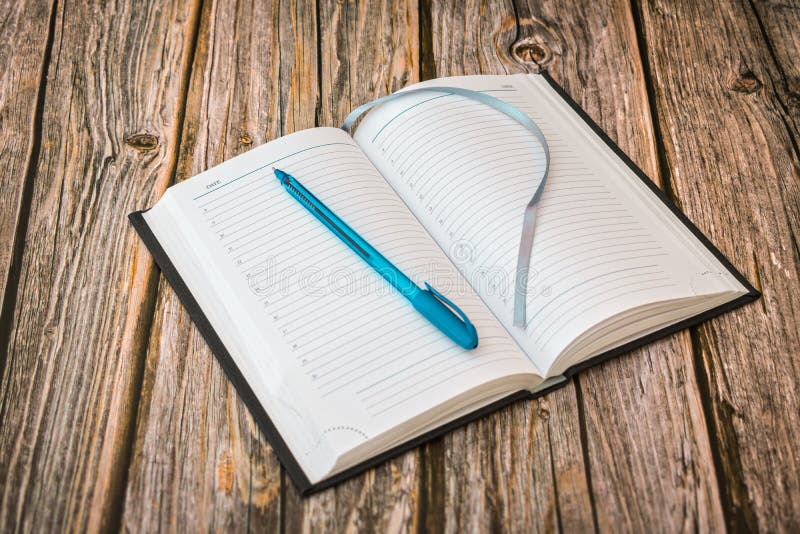 Open Diary with Blank Pages on Which a Ballpoint Pen Rests Stock Image ...