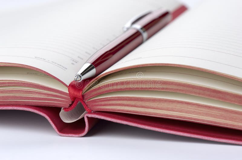 Open diary and pen red stock photo. Image of information - 64040642