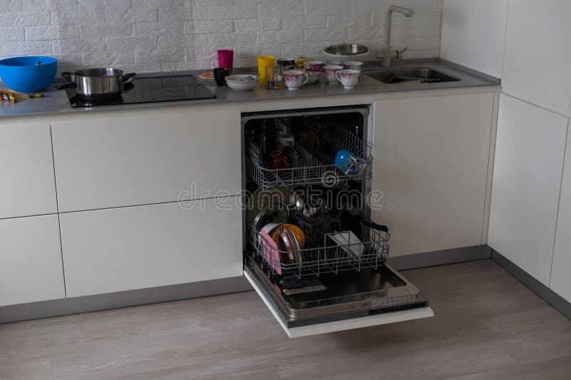 Open Dishwasher with Clean Dishes in the White Kitchen Stock Photo ...